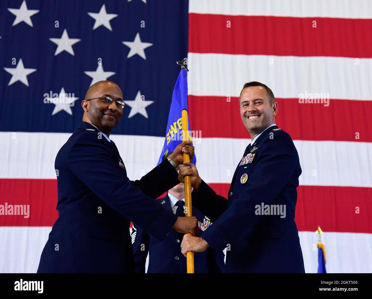 U.S. Air Force Col. JohnPaul Mintz, accepts command and the guidon of ...