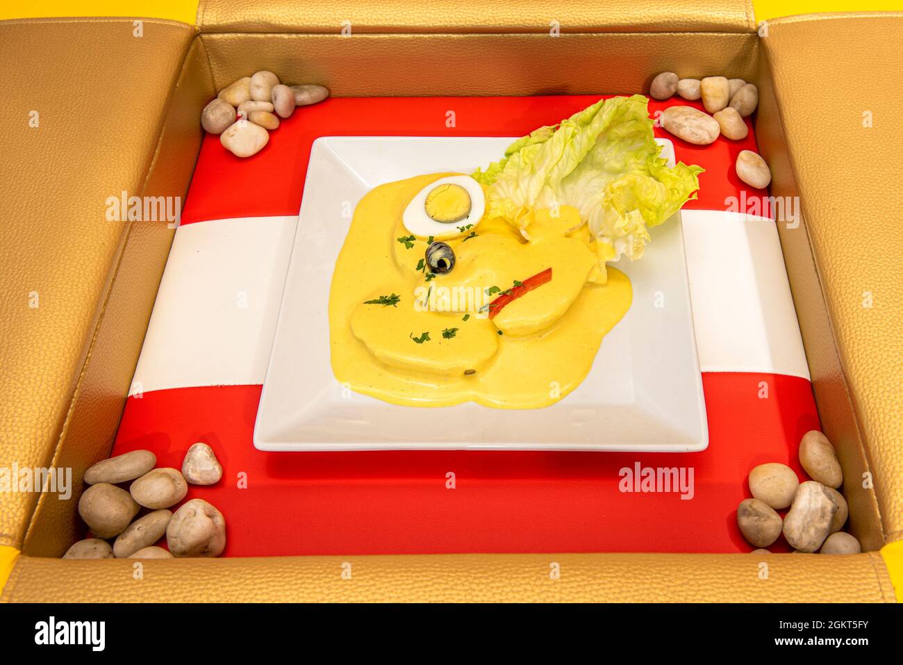 Typical Peruvian recipe of potatoes a la huancaina on the flag of Peru ...