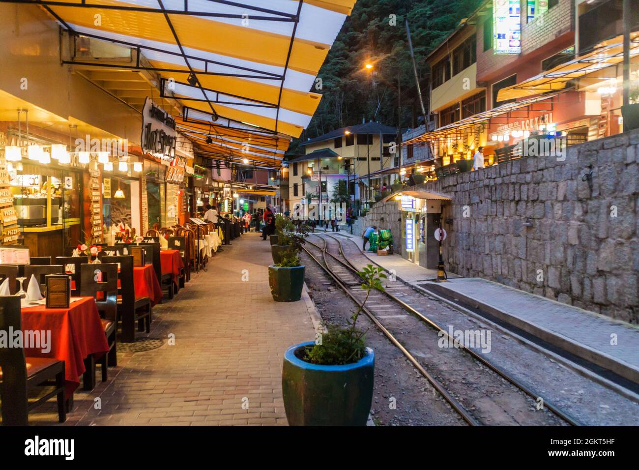 AGUAS CALIENTES, PERU - MAY 17, 2015: Train station and restaurants in ...