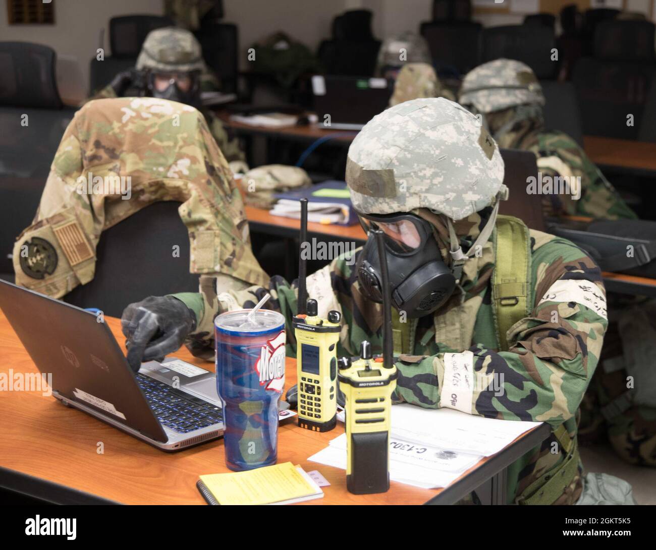An Airman with the 143d Airlift Wing, works in the COC (Command ...