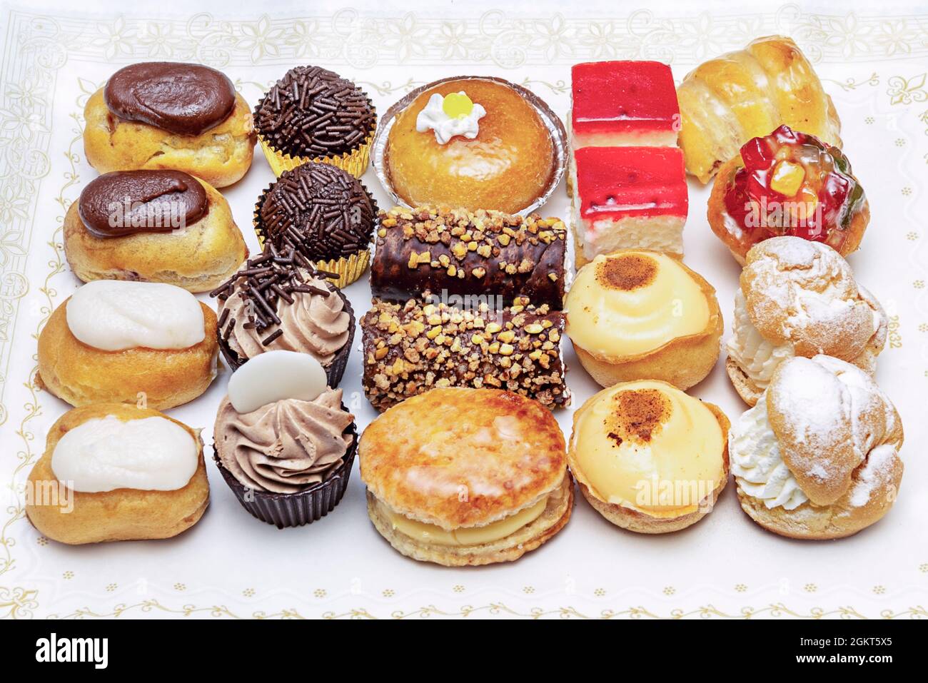 tray of cupcakes of varied flavors of Spanish pastry indicated for ...