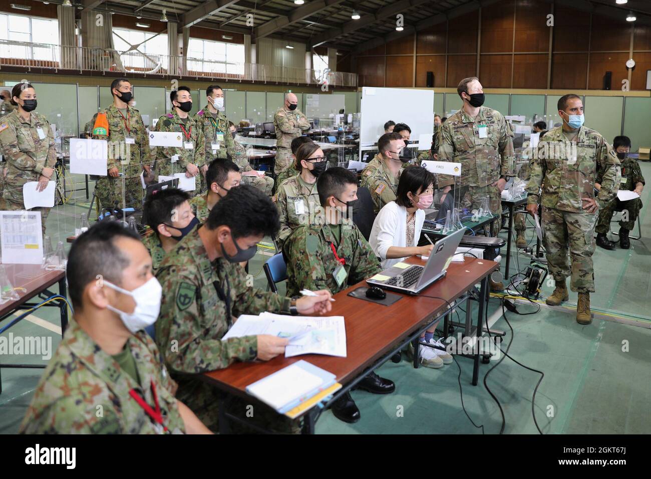 The attendees of the Multi-Domain Operations working group review ...