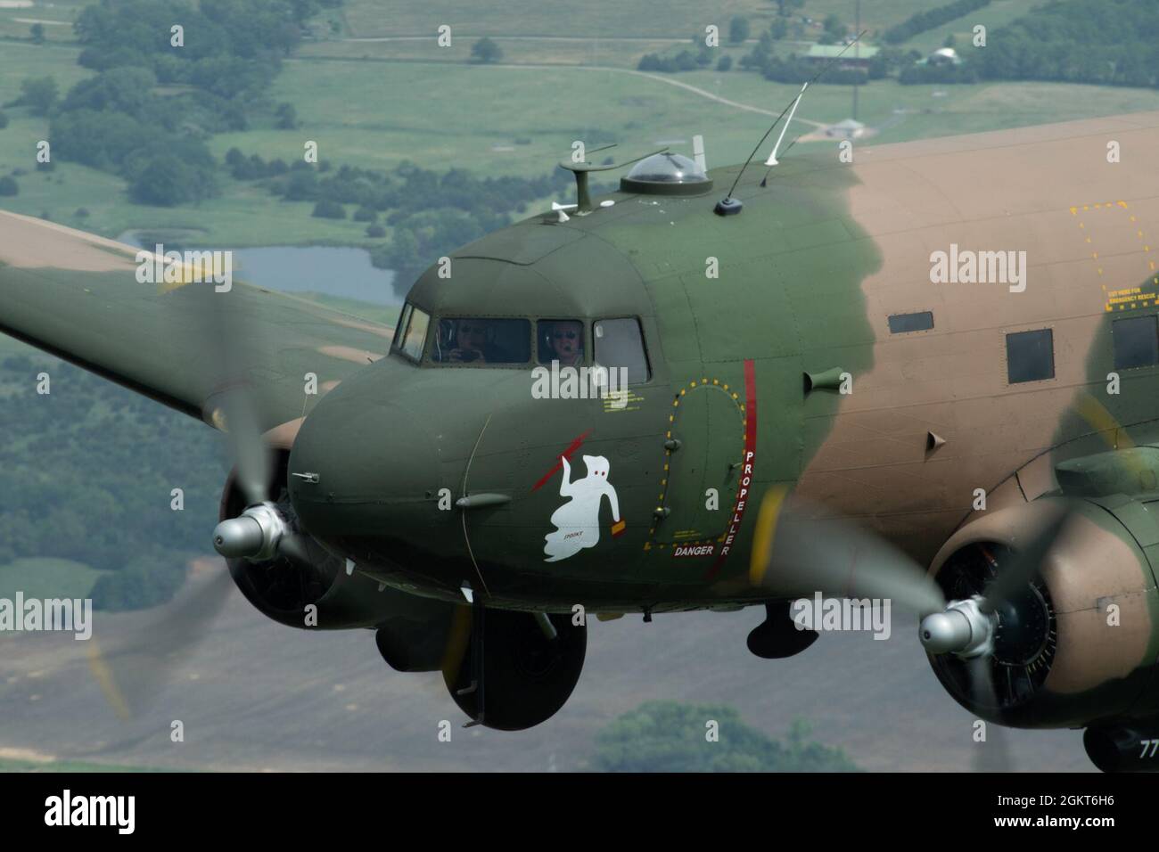 An AC-47 from Topeka, Kansas flies in formation around Topeka June 25 ...
