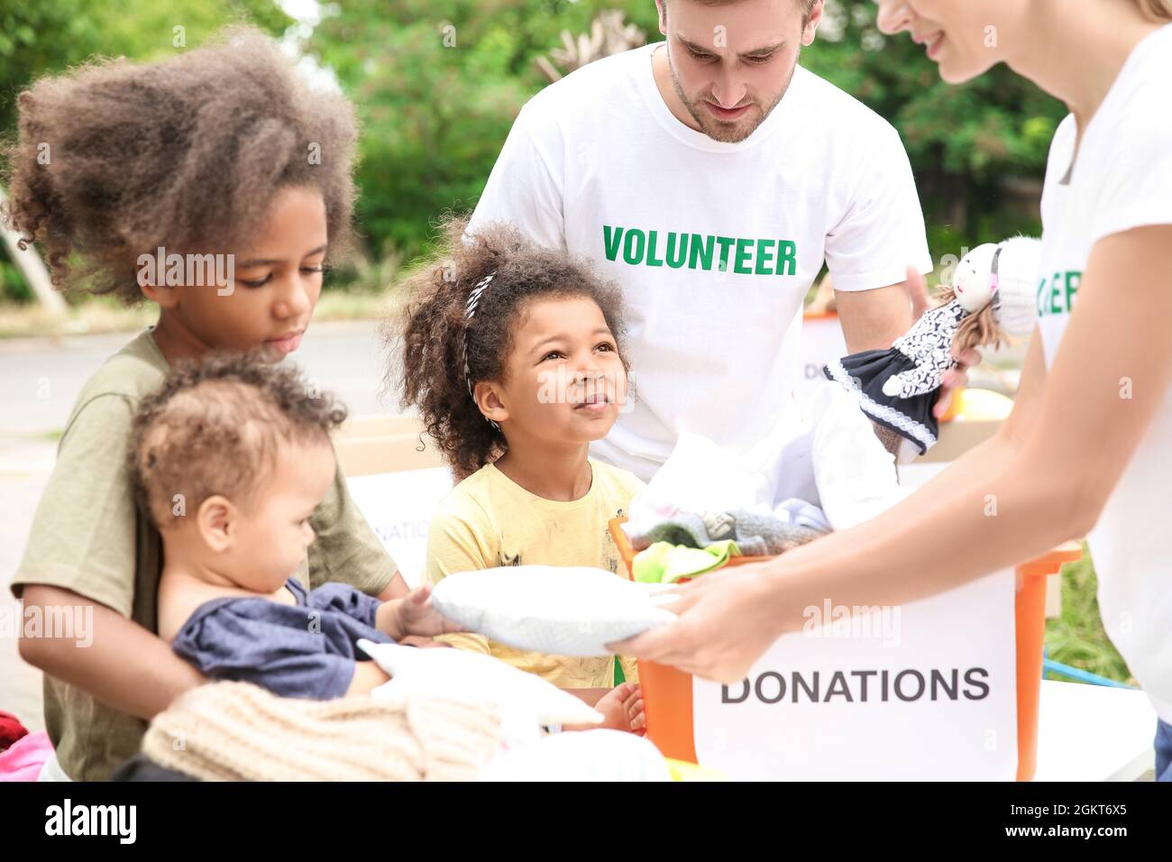 Child hands sharing toys hi-res stock photography and images - Alamy