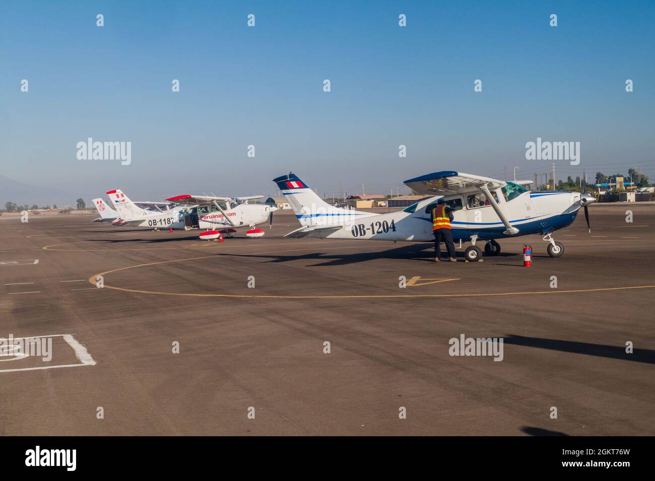 NAZCA, PERU - MAY 31, 2015: Small airplanes on an airstrip of Nazca ...