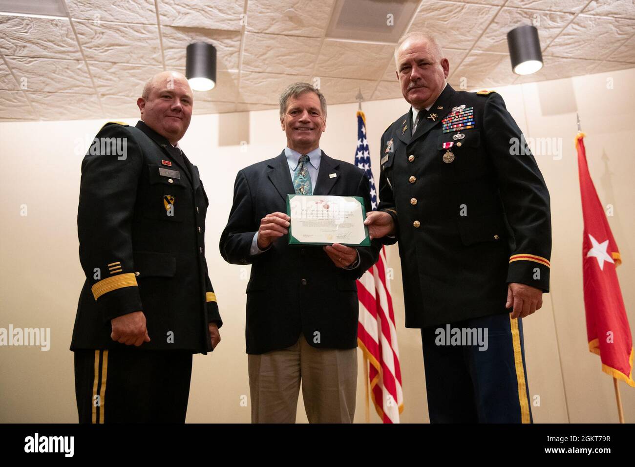 Col. Terry Jenkins is presented with awards at his retirement ceremony ...