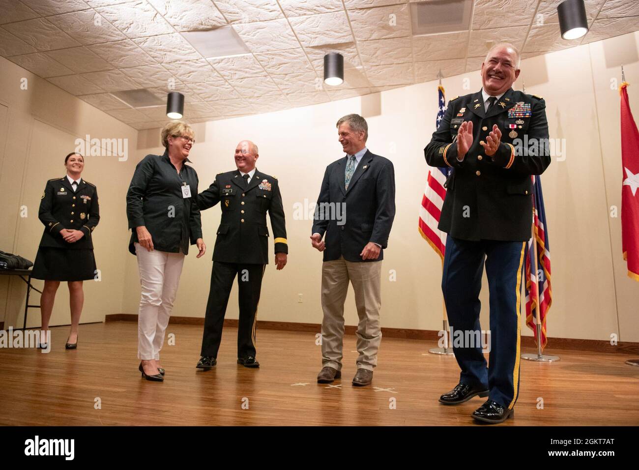 Col. Terry Jenkins’ wife Susan comes on stage to be presented awards ...