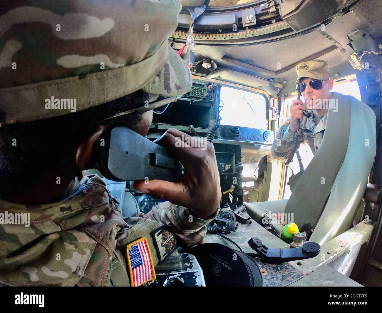 Army Reserve Staff Sgt. Ryan Sanders (right), division master gunner ...
