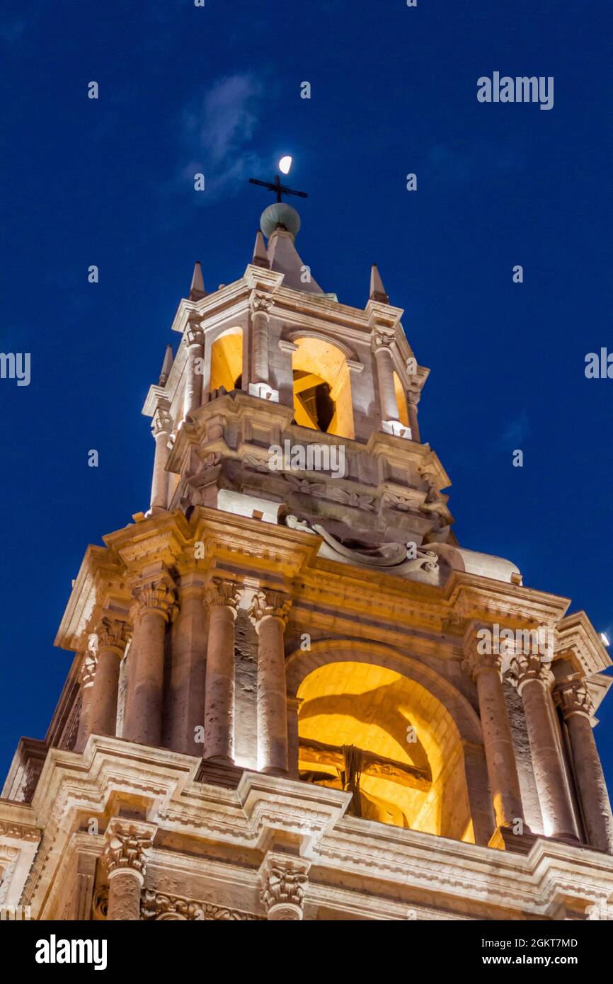 Tower of a cathedral and the moon at Plaza de Armas square in Arequipa ...