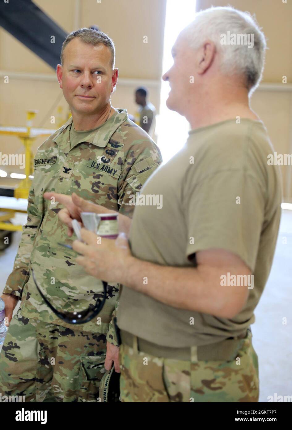 Task Force Phoenix Commander Col. Alan Gronewold, left, has a ...