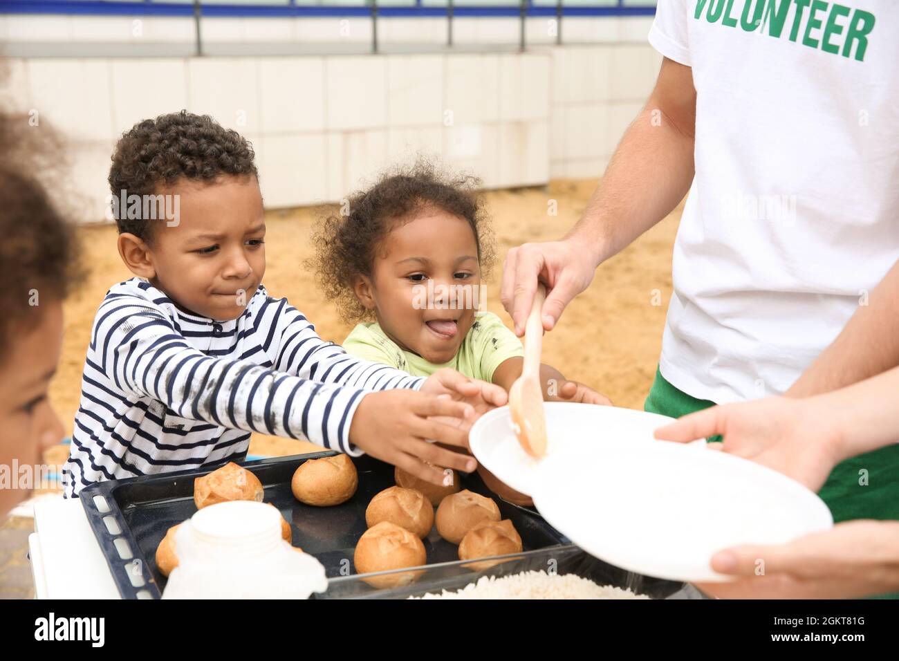Hands charity food poor kids hi-res stock photography and images - Alamy
