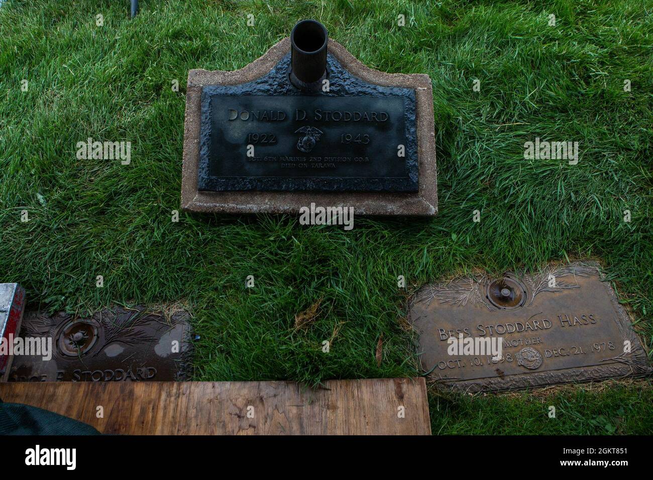 The tombstone for U.S. Marine Corps Sgt. Donald D. Stoddard lays next ...