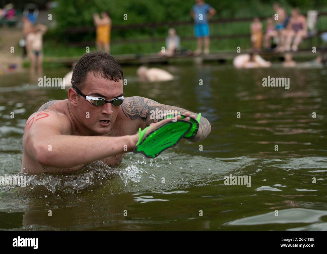 British Army LCpl. Peter Arnold prepares to swim during the "iSwim/iRun ...