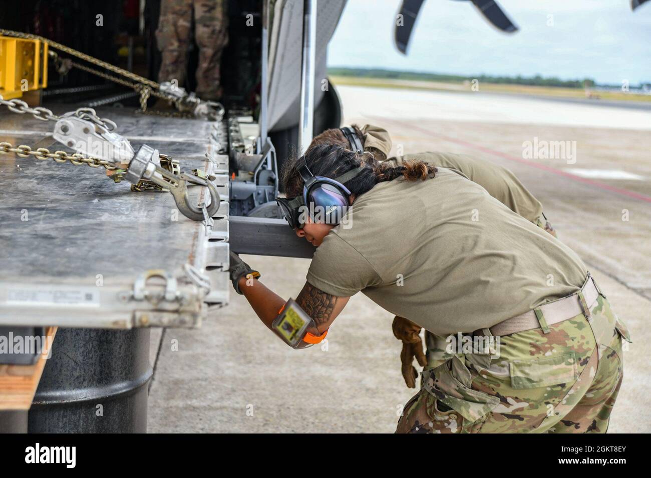 U.S. Air Force Staff Sgt. Laura Vigil and Staff Sgt. Trevor Williams ...