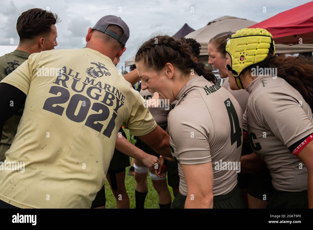 U.S. Marines assigned to the All-Marine Rugby Team huddle together ...