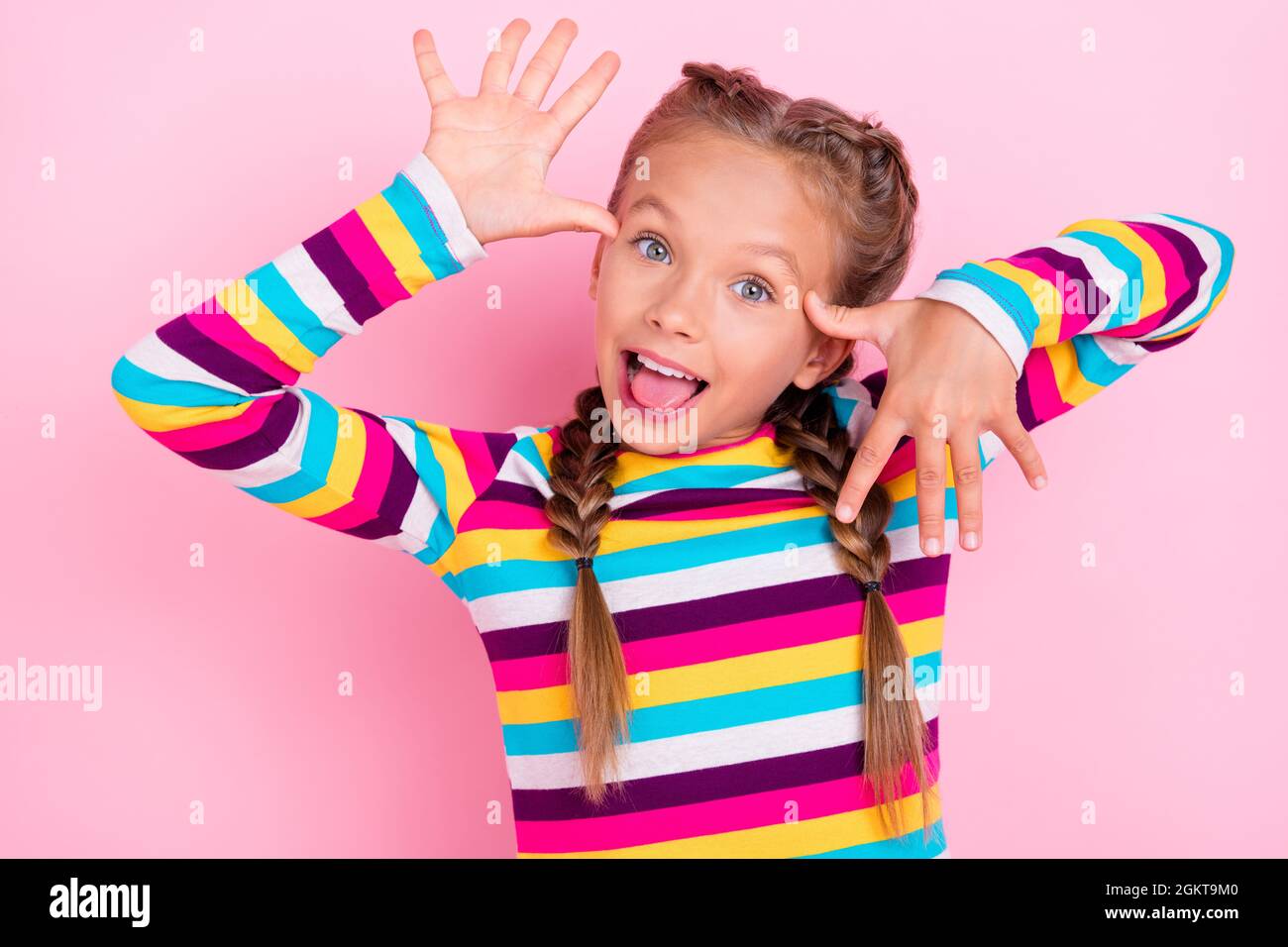 Photo of funky foolish little lady mocking bully hands temples wear ...