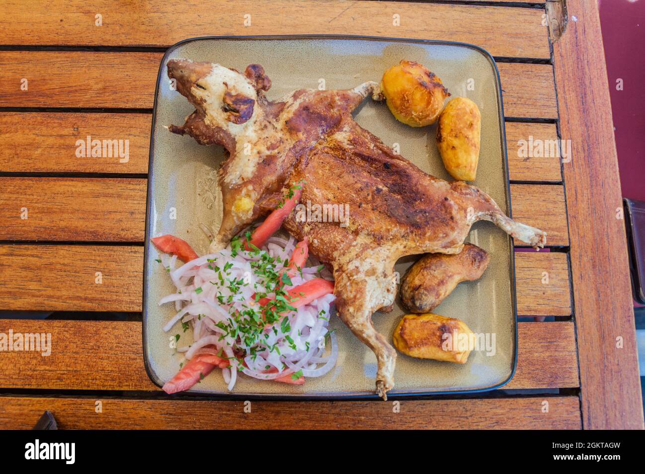 Roasted guinea pig, traditional meal in Peru Stock Photo - Alamy
