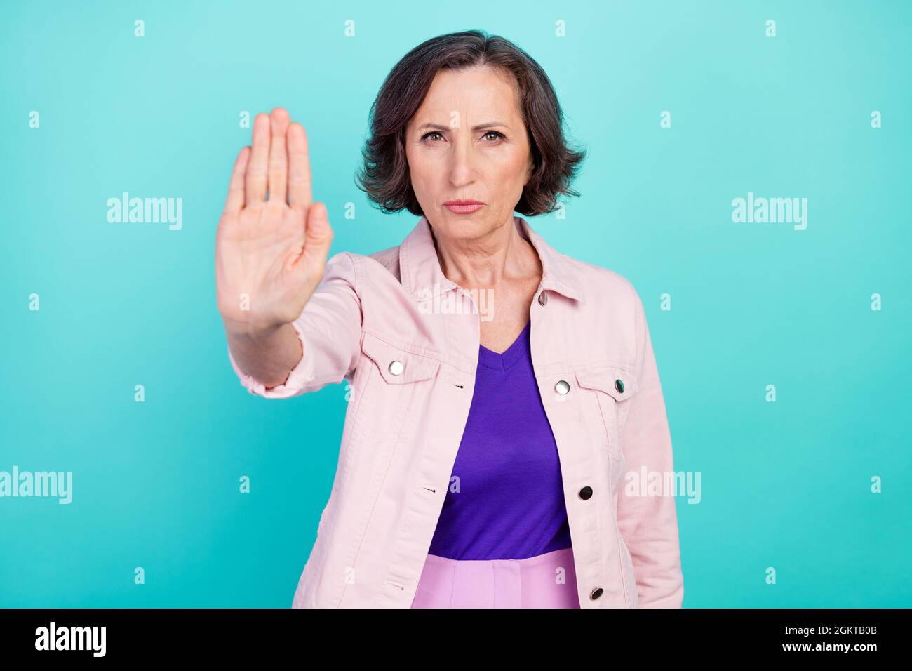 Photo portrait woman in casual clothes showing protest stop sign ...