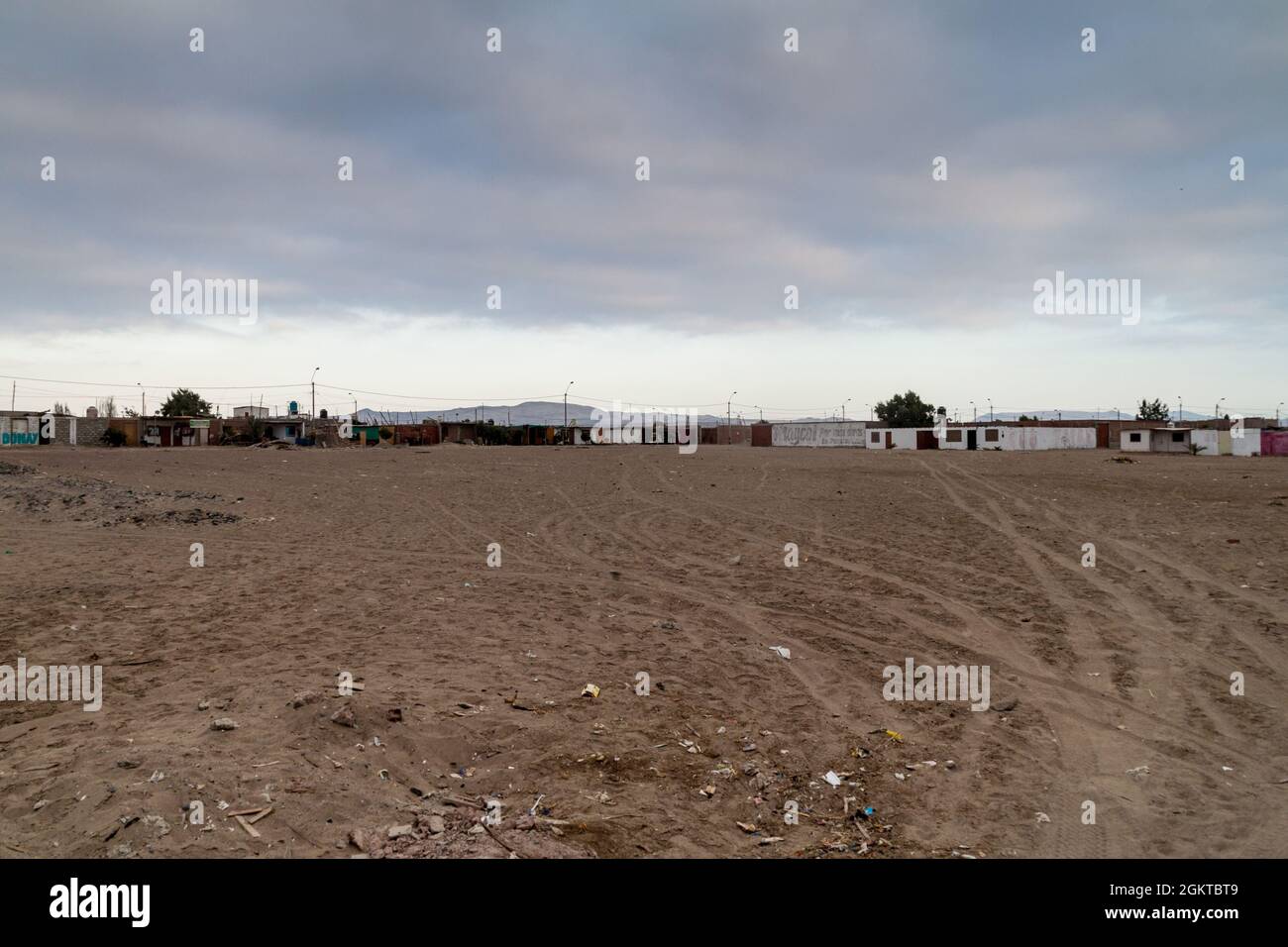Square in a poor neighborhood of Paracas town, Peru Stock Photo - Alamy