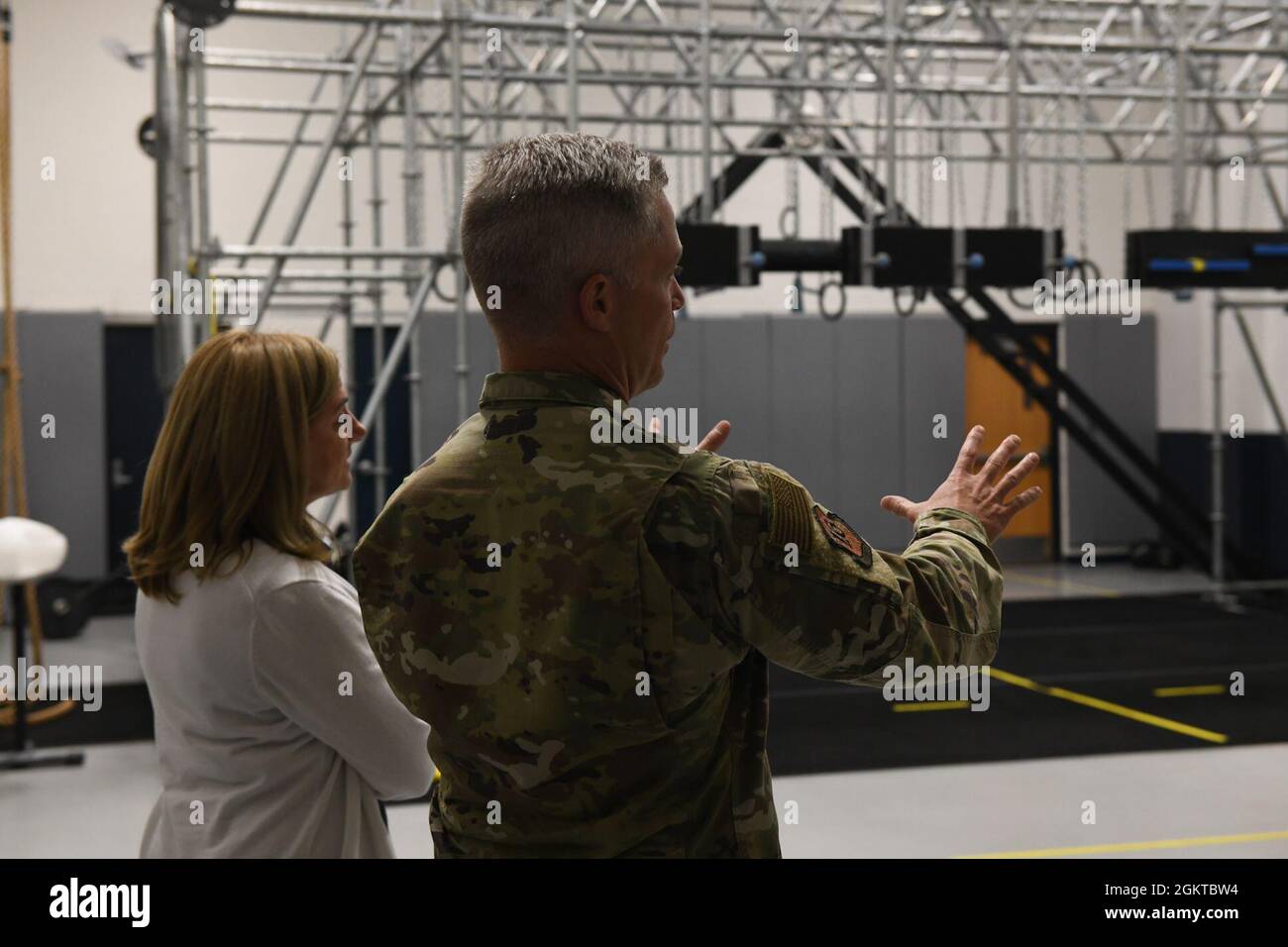 Lt. Gen. Timothy Haugh, 16th Air Force commander, stands with his wife ...