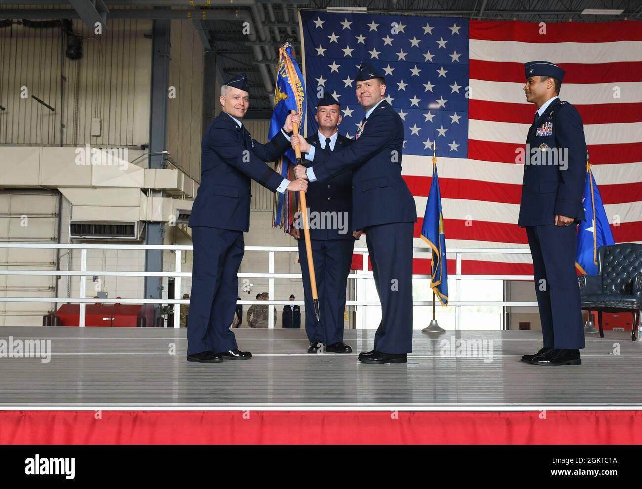 Lt. Gen. Timothy Haugh, 16th Air Force commander, receives the guidon ...