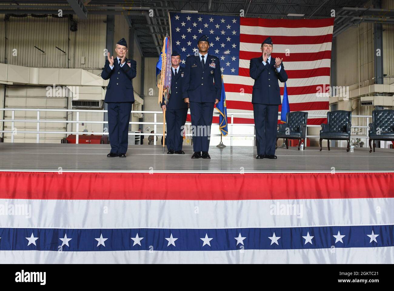 Lt. Gen. Timothy Haugh, left, 16th Air Force commander, applauds with ...