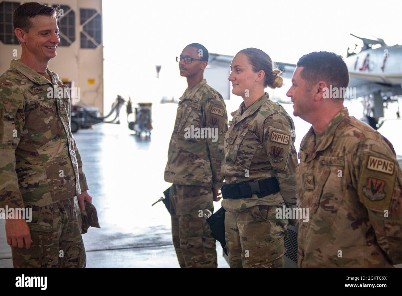 U.S. Air Force Col. Russell Cook, left, 23d Wing commander, talks to a ...