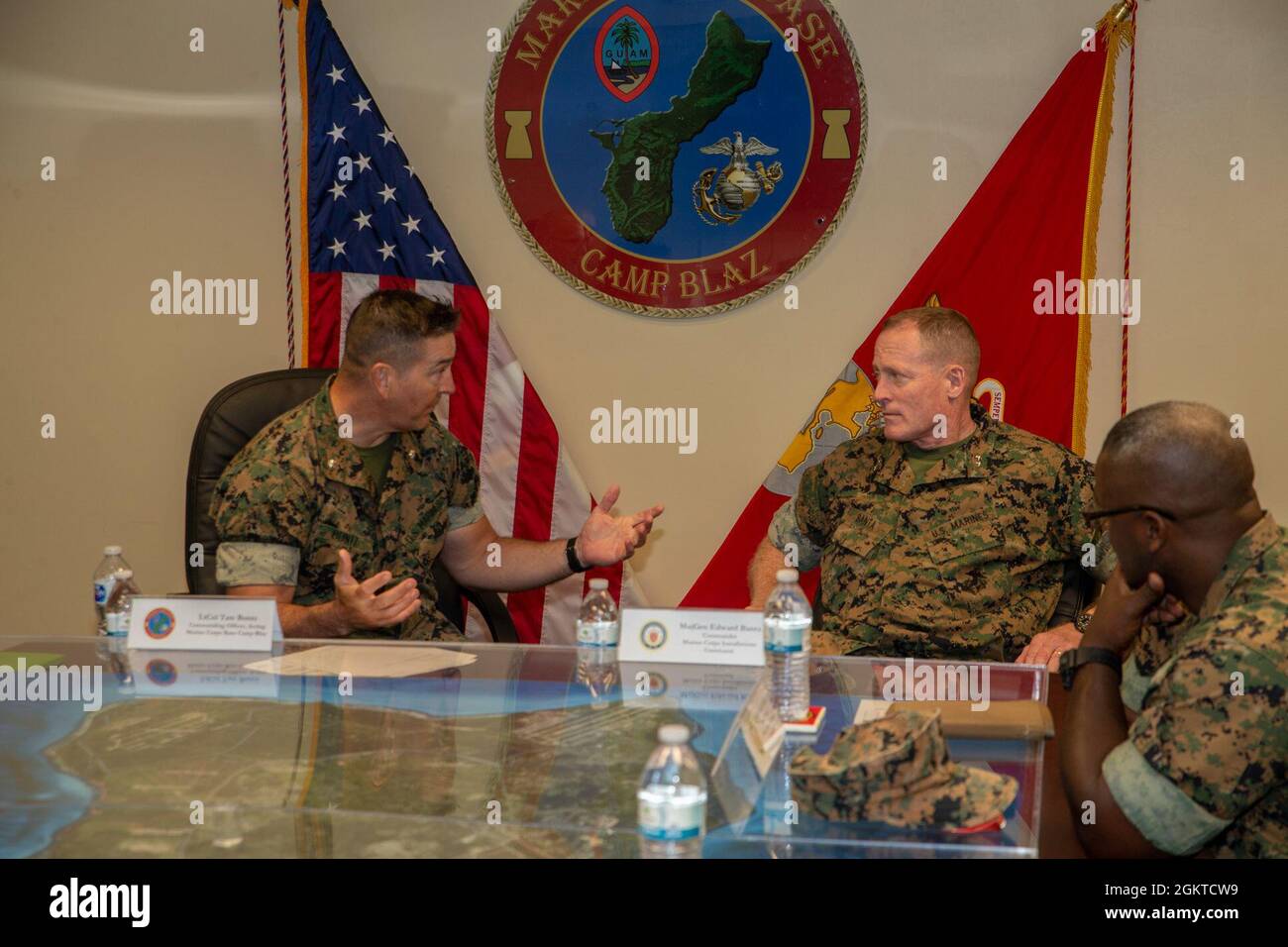 Lt. Col. Tate Buntz, the Marine Corps Base (MCB) Camp Blaz Operations Officer, left, briefs Maj ...