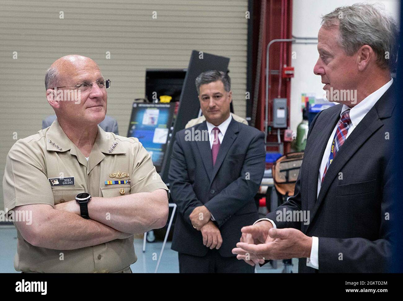 Chief of Naval Operations Adm. Mike Gilday (from left) speaks with Naval Undersea Warfare Center ...