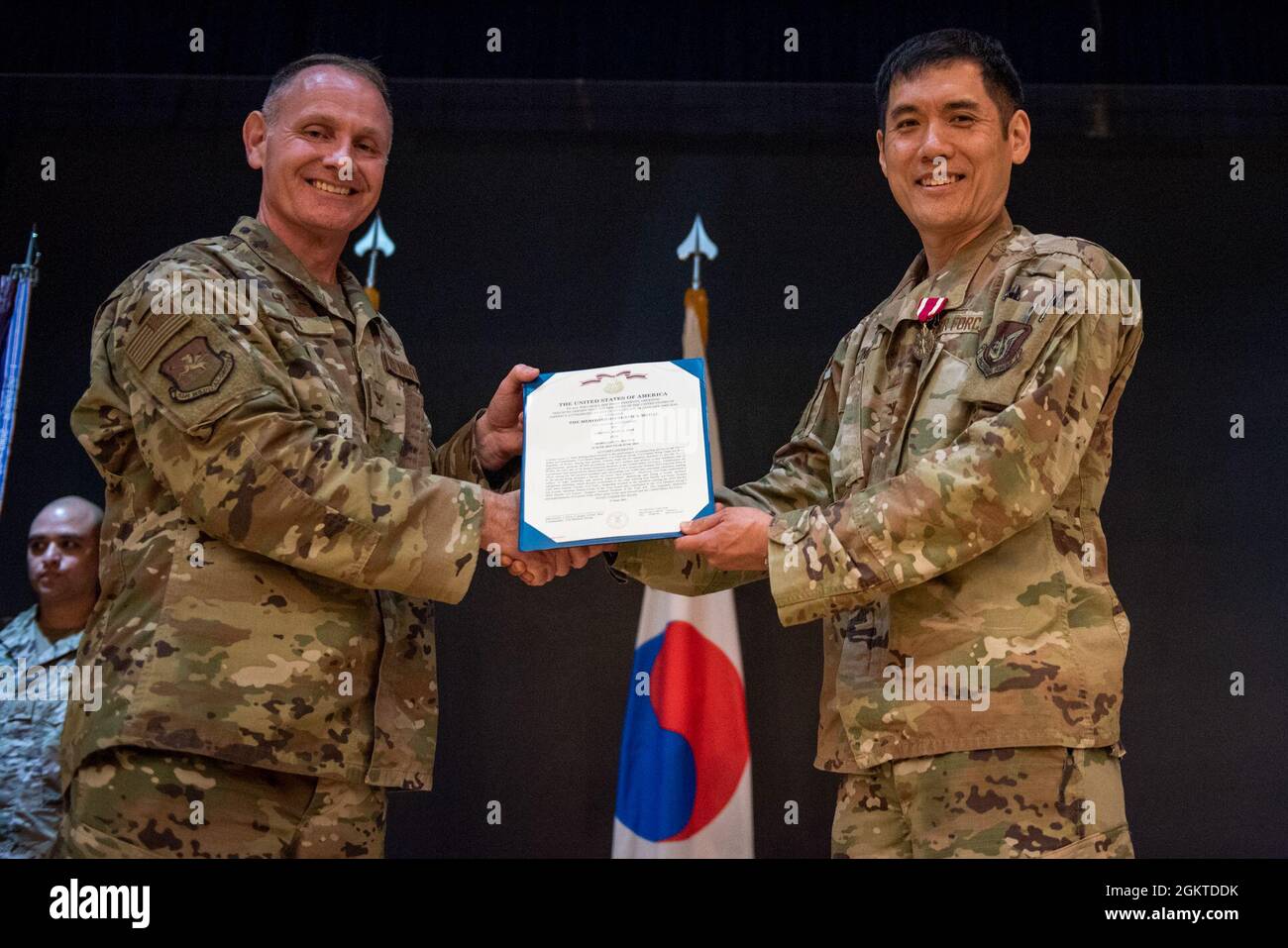 Col. Michael Fea, 51st Medical Group commander, left, awards the Legion ...