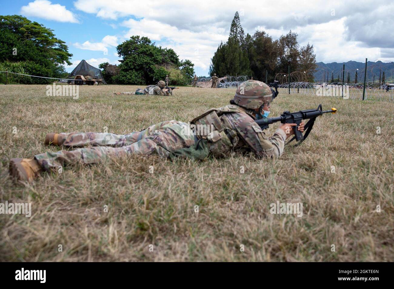Spc. John Trapp (background) and Spc. Sunshine Chee (foreground), Cooks ...