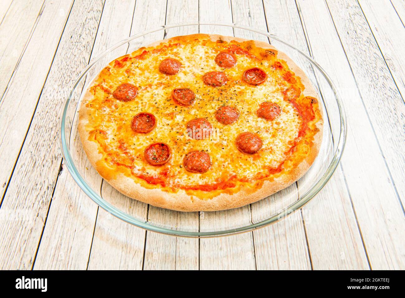 Classic spicy pepperoni Italian pizza with lots of cheese and oregano ...