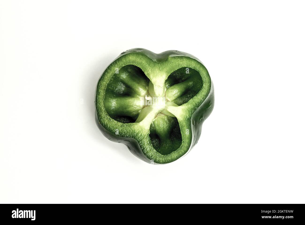 Green pepper cut in half to show its inner cavities Stock Photo - Alamy