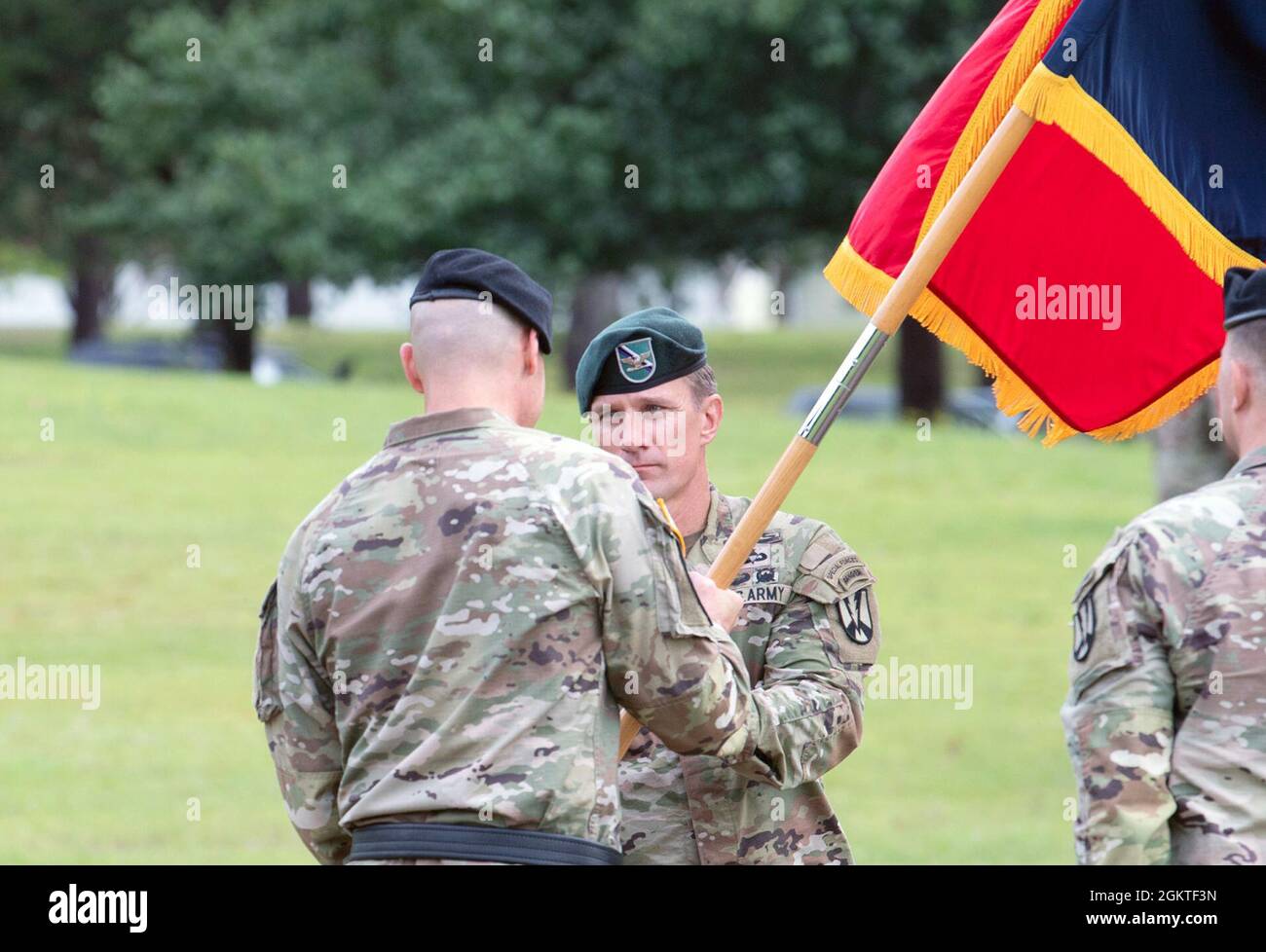 Col. Kent G. Solheim, 165th Infantry Brigade commander, receives the ...