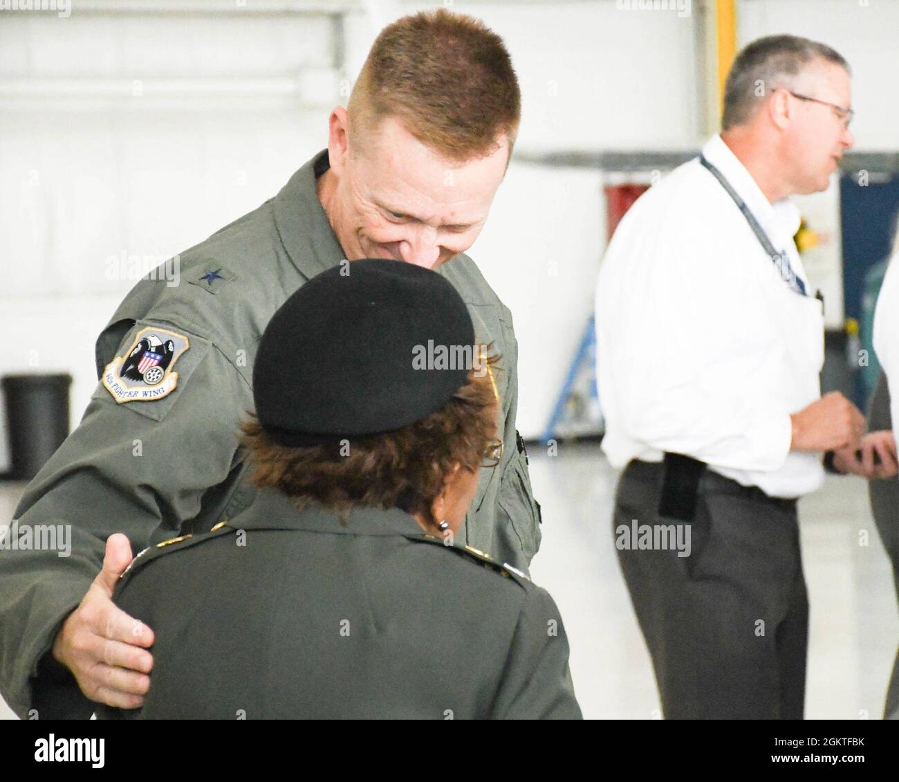 Brig. Gen. Mike Schultz, the 442d Fighter Wing commander, speaks with ...