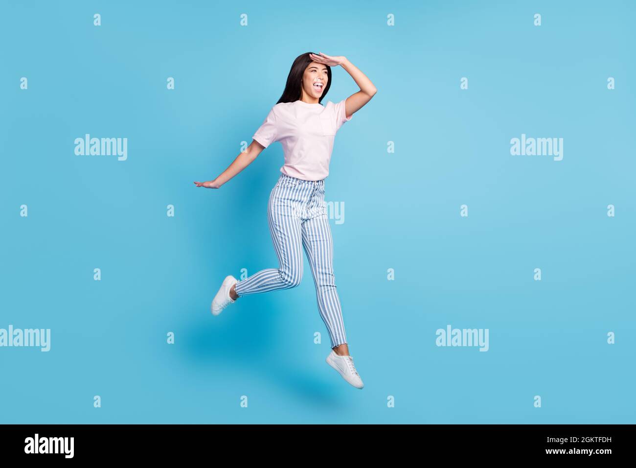 Full length body size view of attractive cheerful ecstatic thin girl jumping searching way ...