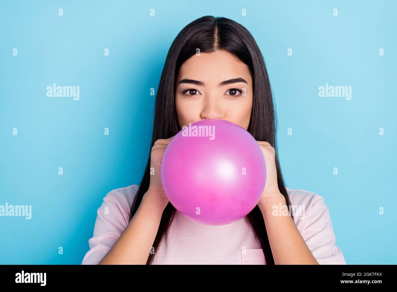 Photo of young girl blow inflate air balloon preparation event ...