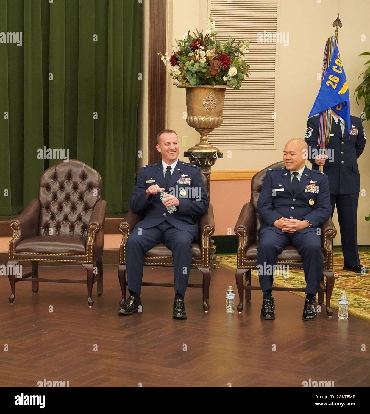 Lt. Col. Johnathan French and Lt. Col. Daniel Kim jovially embrace in a ...