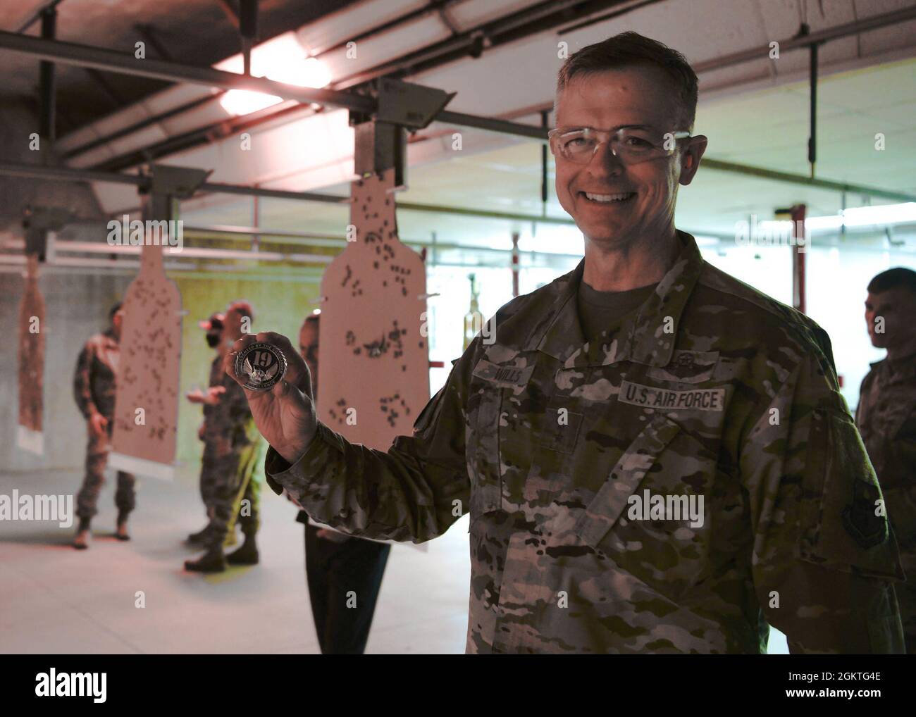 U.S. Air Force Maj. Gen. Craig Wills, 19th Air Force commander, holds a ...