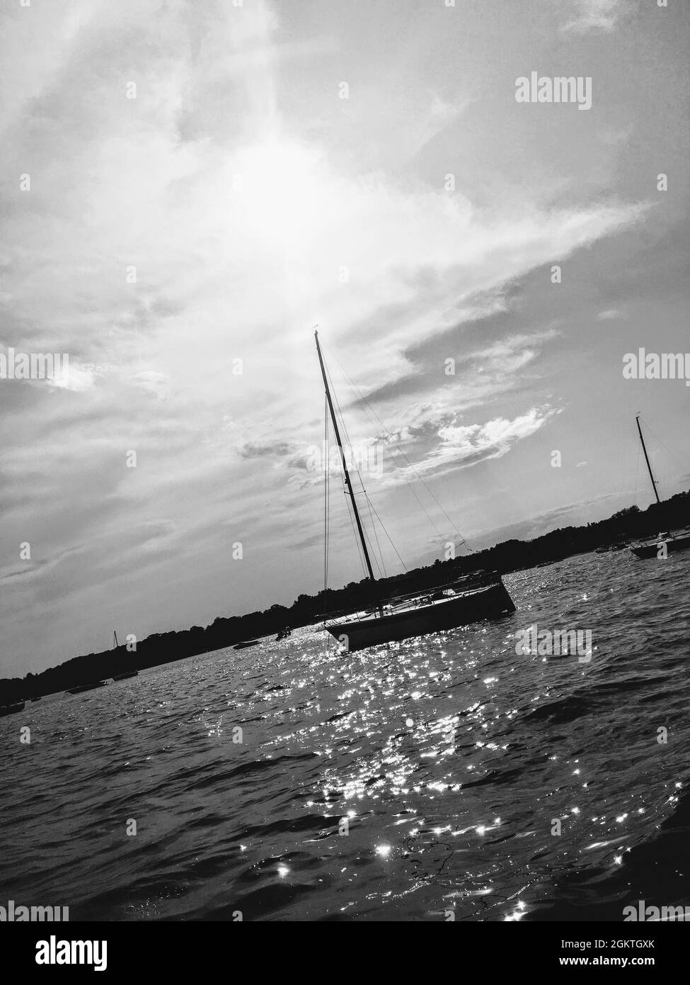 Boats on blue ocean Black and White Stock Photos & Images - Alamy