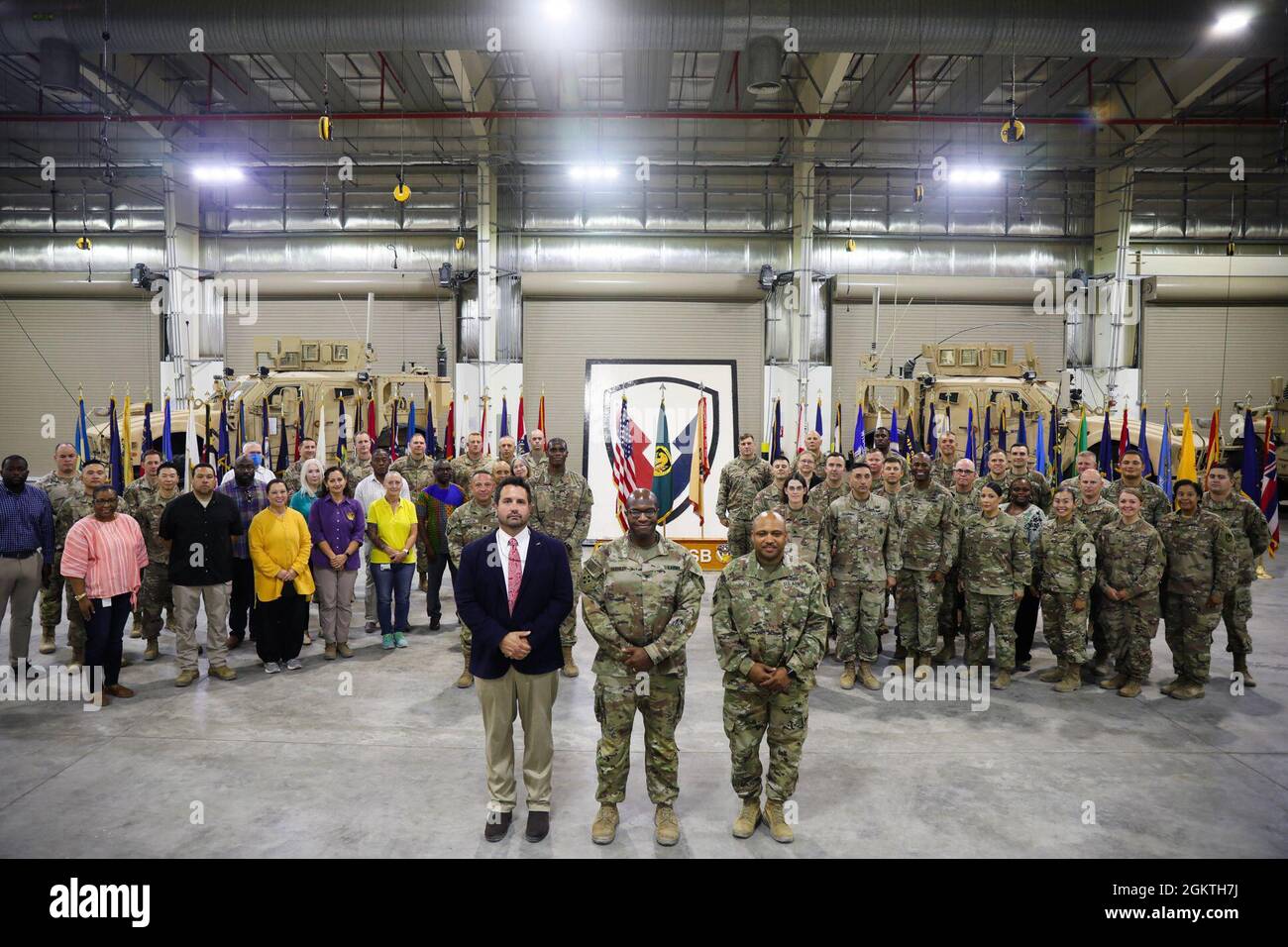 Soldiers and civilians from the 408th Contracting Support Brigade assemble following a change of ...