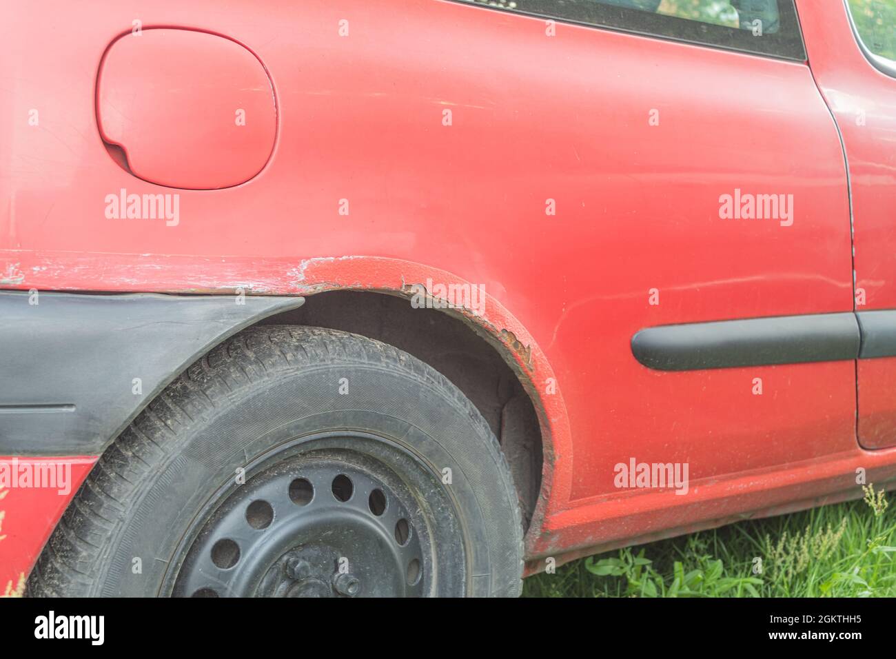 An old and rusty car in need of repair. Rusty scratches on the car ...