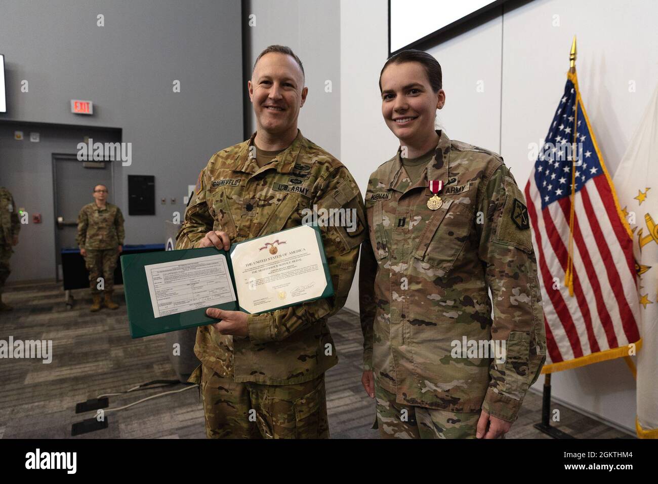 Capt. Regan Keenan is presented the Meritorious Service Medal for ...