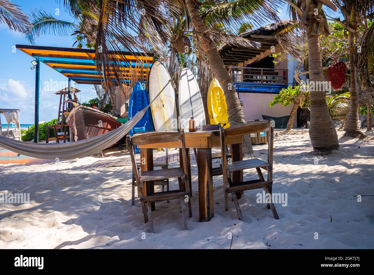 Empty beach restaurant with hammock and kayak on sand at beach Stock ...