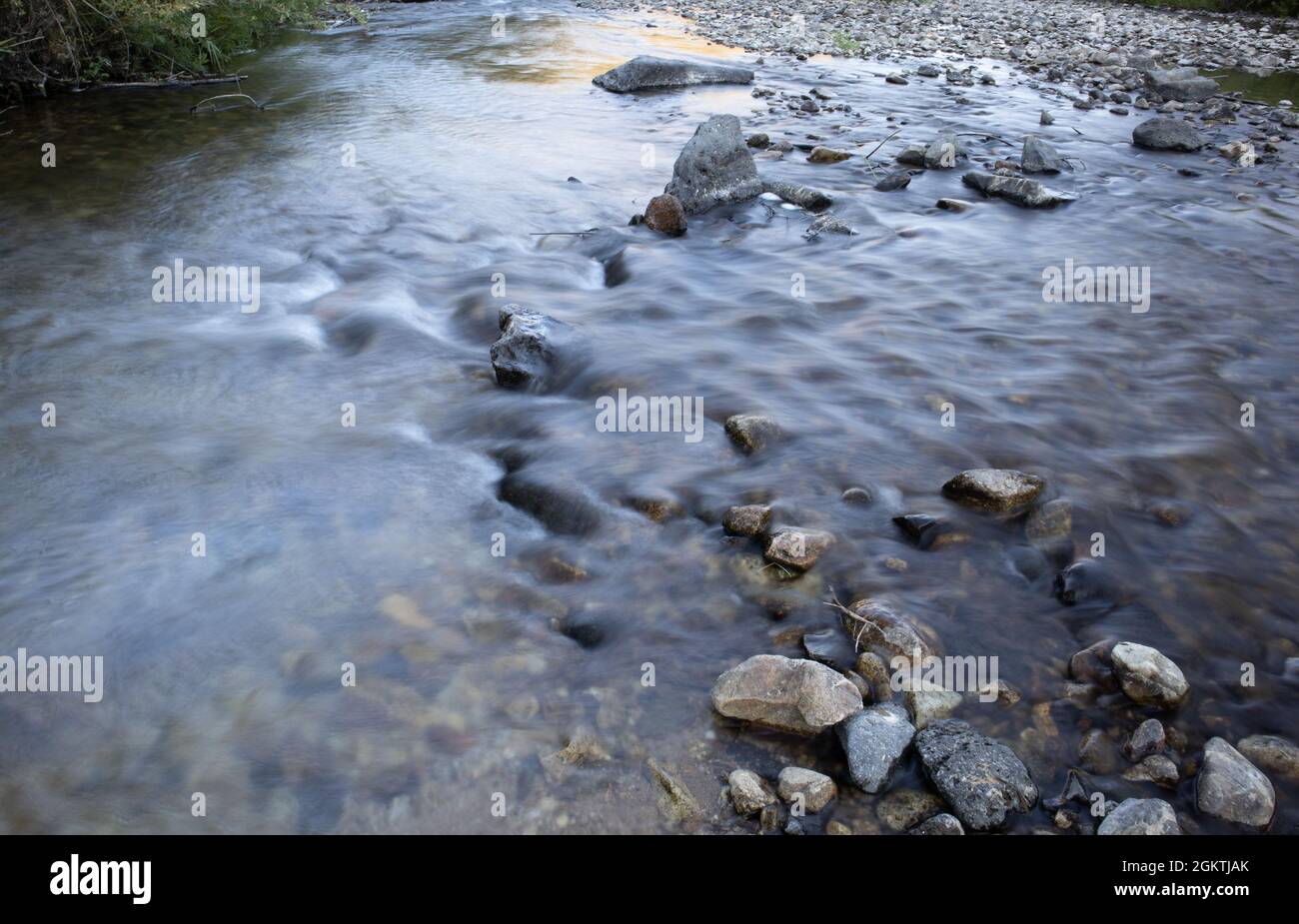 Landscape of a running river surface Stock Photo - Alamy