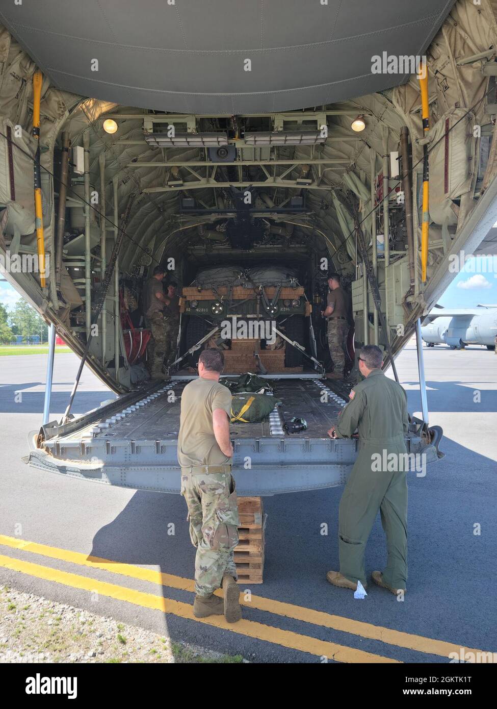 Members of the 43rd Aerial Port Squadron load a Humvee, using a K ...