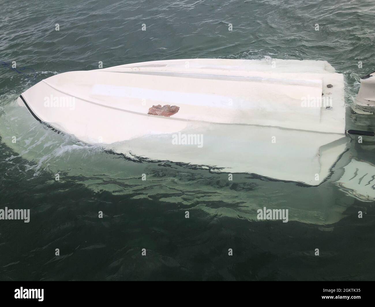 A capsized 19-foot vessel approximately one mile north of Marathon ...