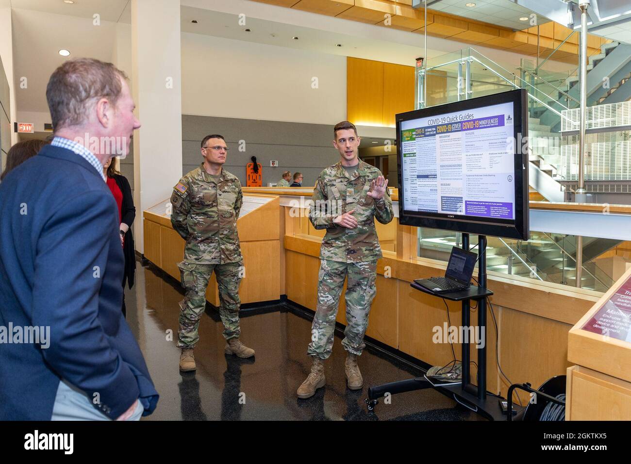 Major Carl Smith (right) briefs Captain Eric Elster (left) on the ...