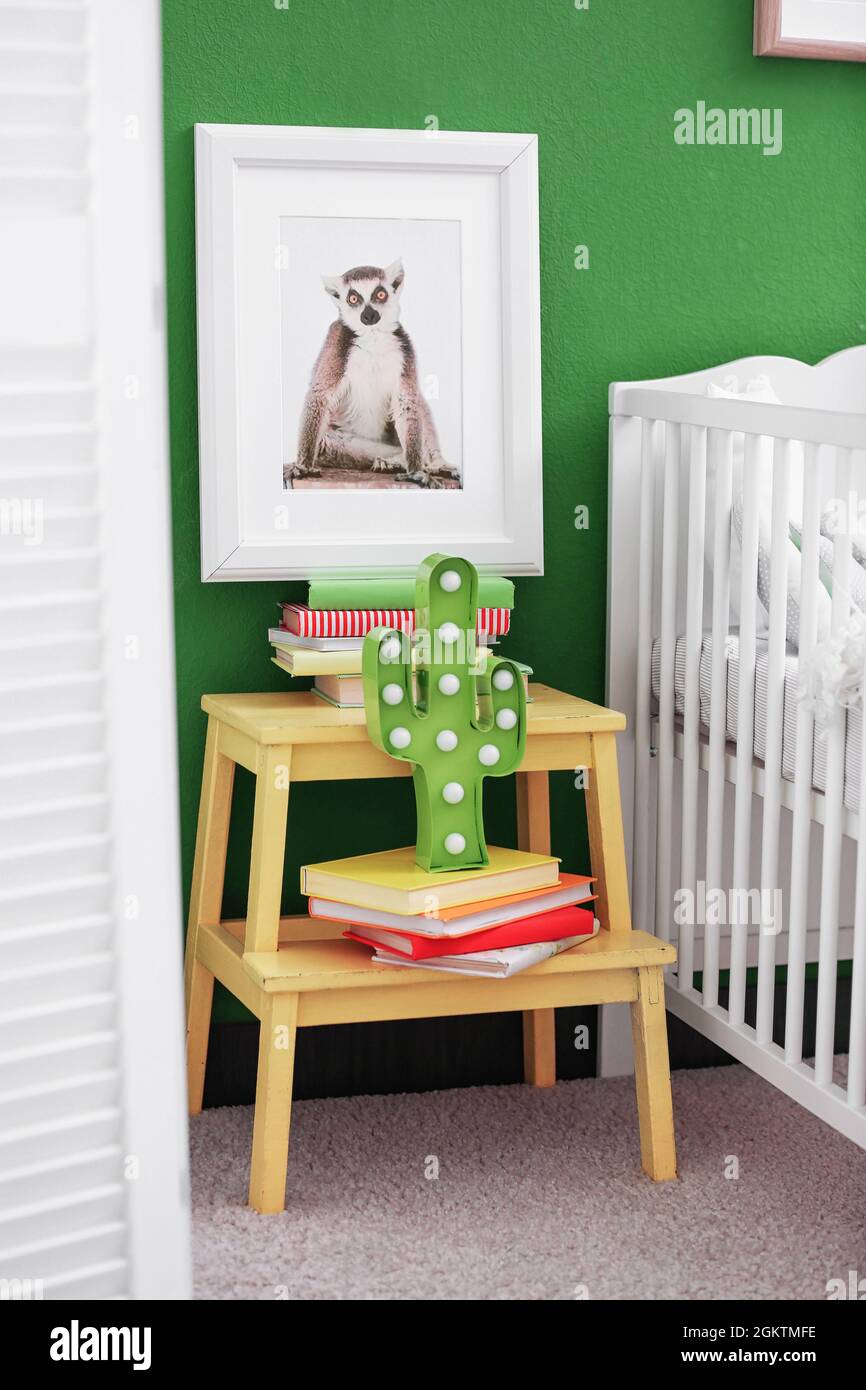 Picture of cute monkey and stand with books in child's room Stock Photo ...