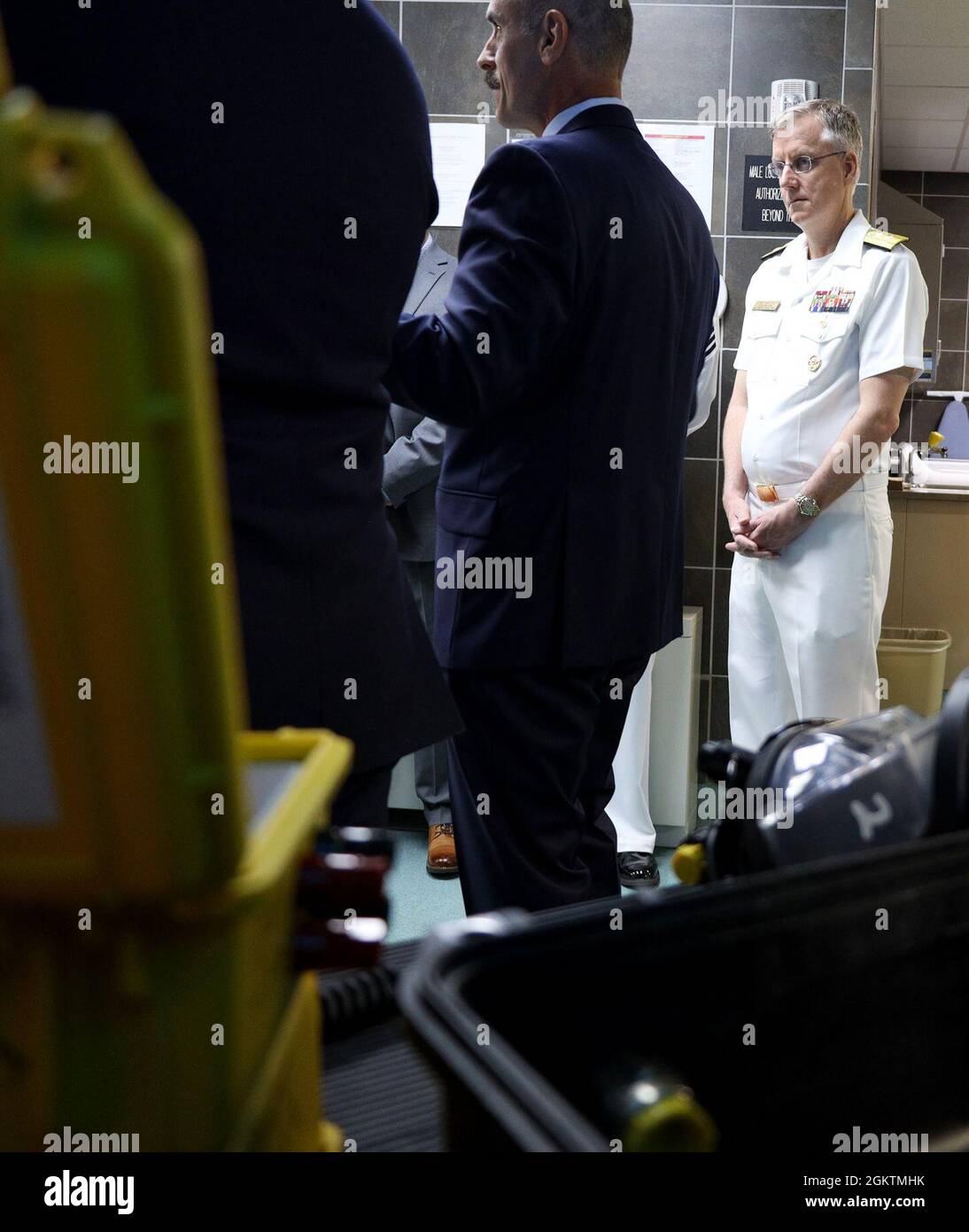 Rear Adm. Tim Weber, Commander, Naval Medical Forces Pacific, listens ...